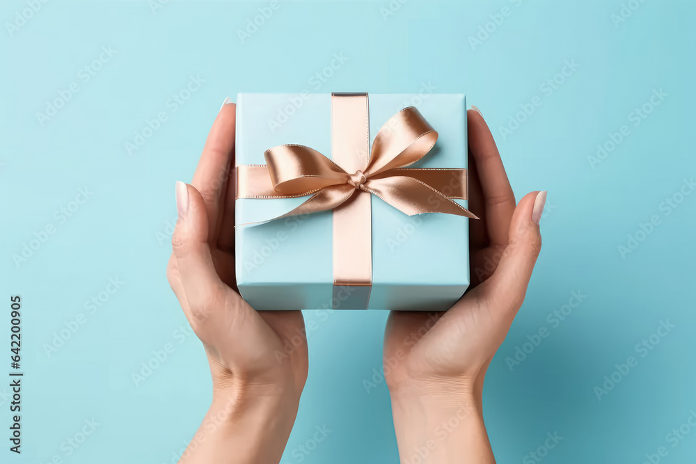 Feel the anticipation of receiving a gift as female hands hold a gift ...