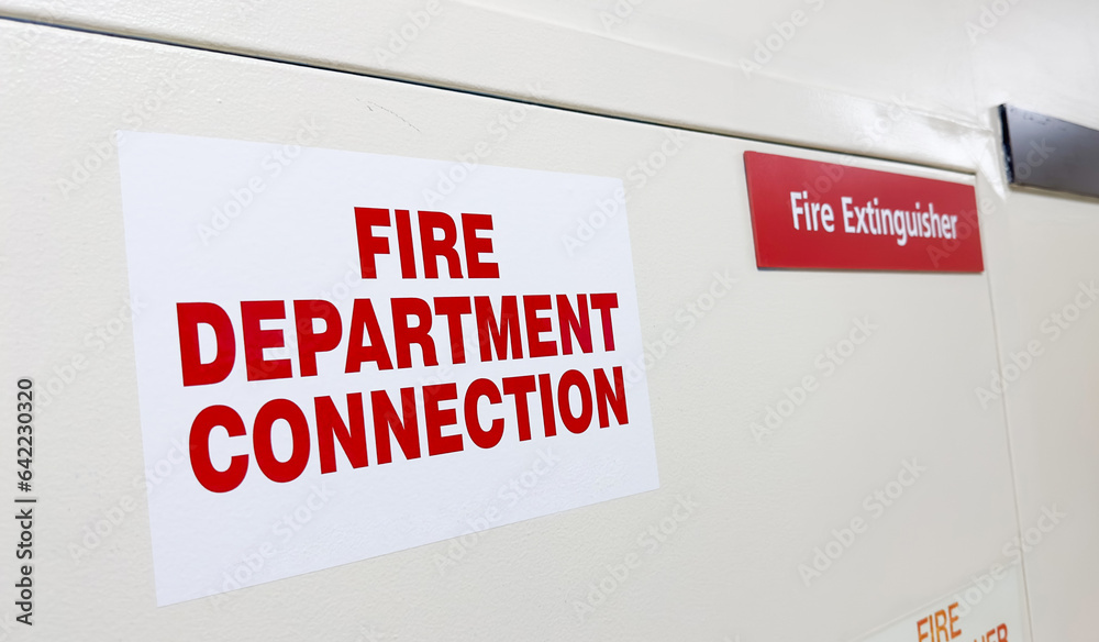 fire department sign guides the way to the fire exit, a vital symbol of ...
