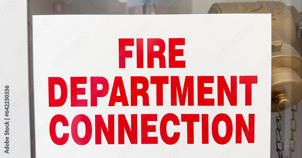 fire department sign guides the way to the fire exit, a vital symbol of ...