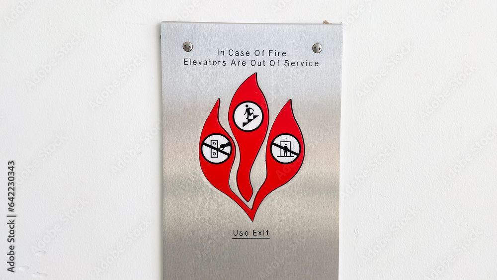 fire department sign guides the way to the fire exit, a vital symbol of ...