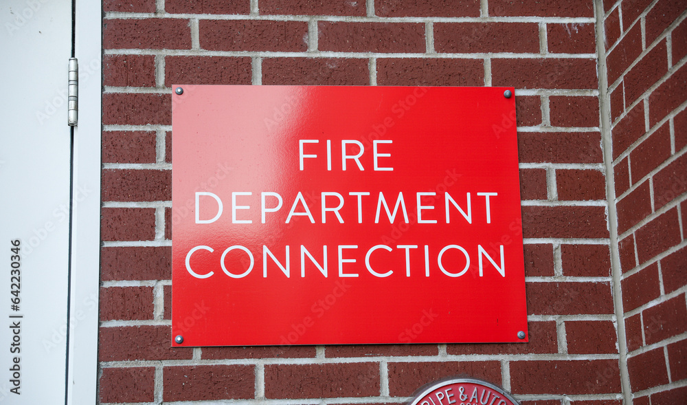 fire department sign guides the way to the fire exit, a vital symbol of ...