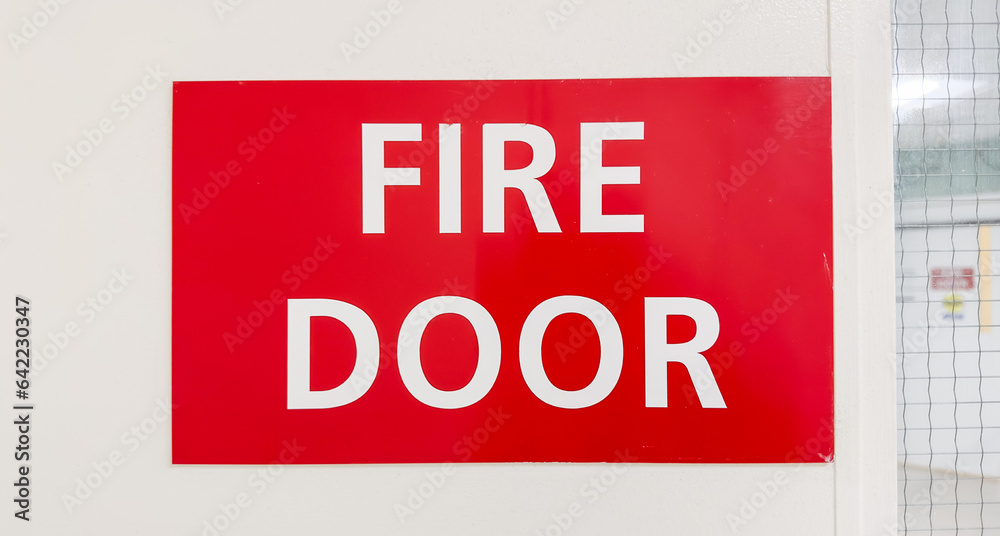 fire department sign guides the way to the fire exit, a vital symbol of ...
