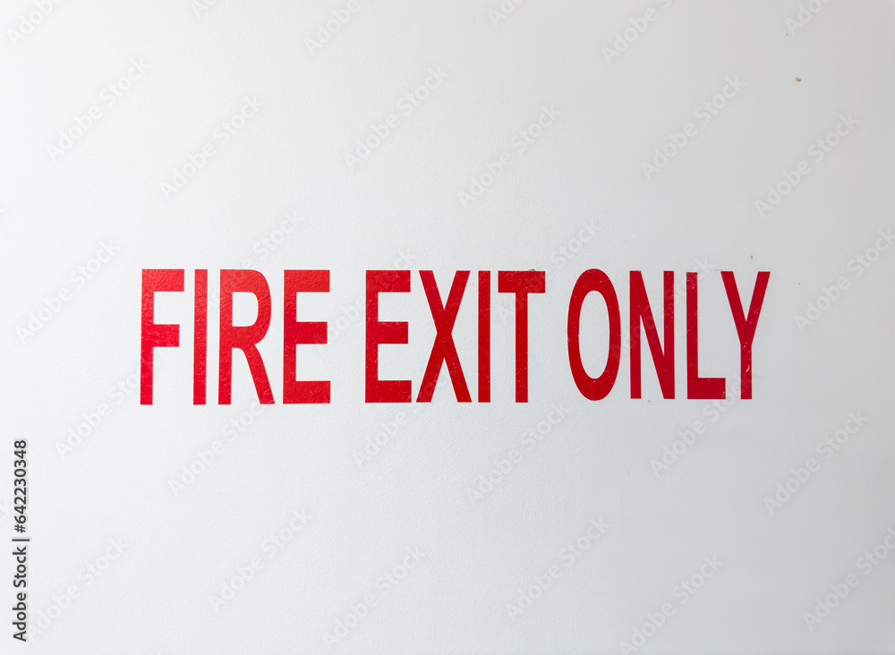 fire department sign guides the way to the fire exit, a vital symbol of ...