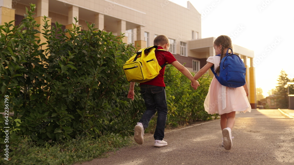 elementary school children run road school. happy school life. children ...