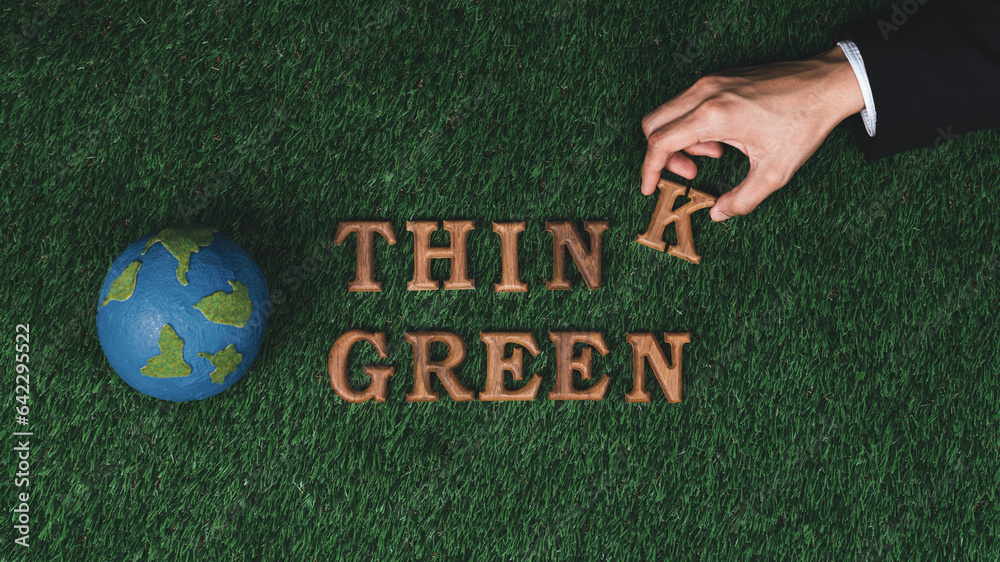 Hand arrange wooden alphabet in ecological awareness campaign with ECO ...