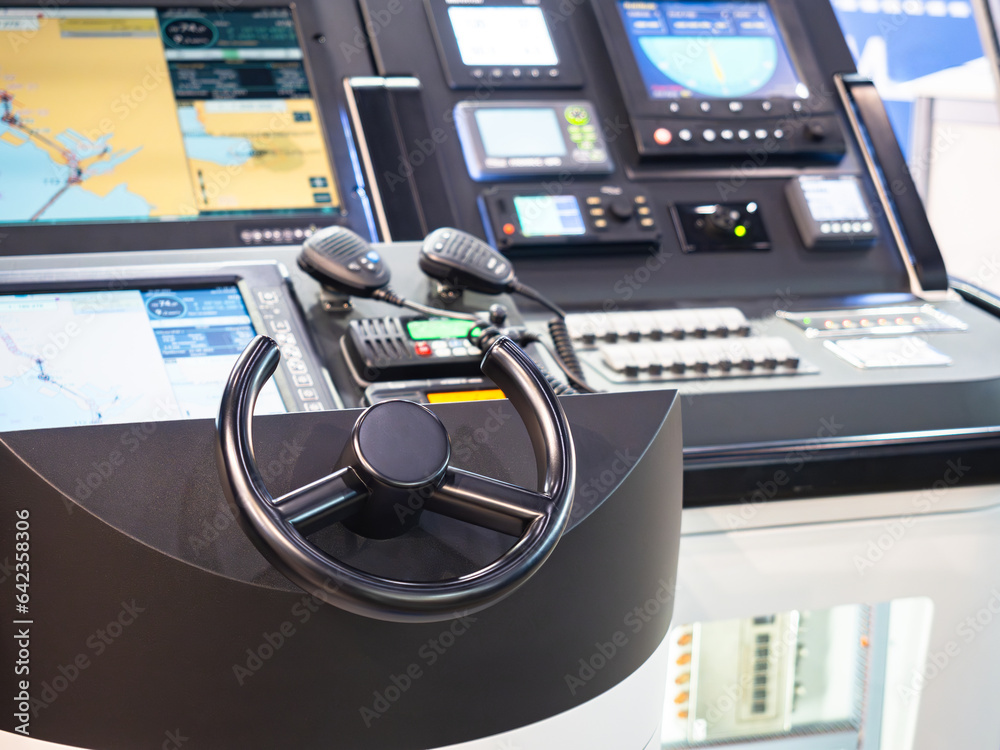 Steering wheel of ship. Modern ship dashboard. Electronic equipment for ...