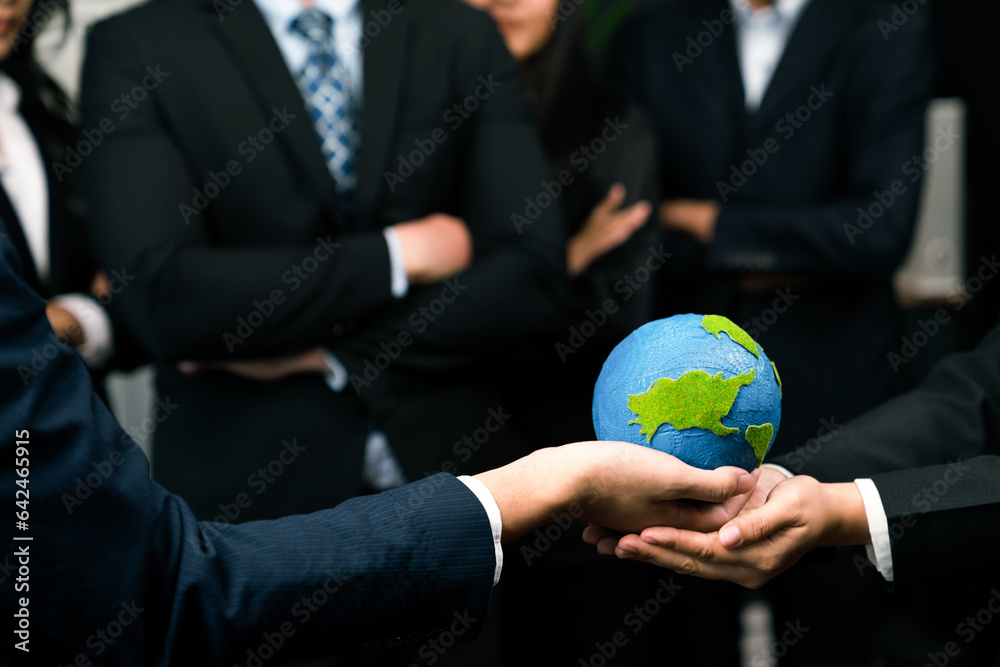 Top view business people holding Earth together in synergy as team ...