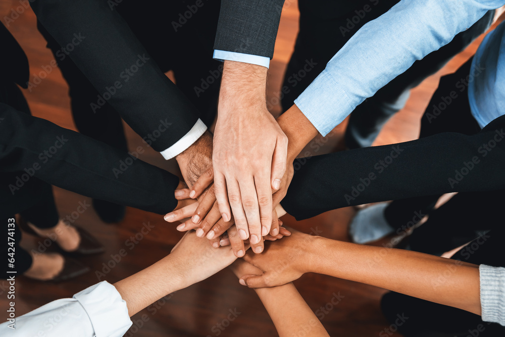 Multiracial business people make synergy hand stack together in meeting ...