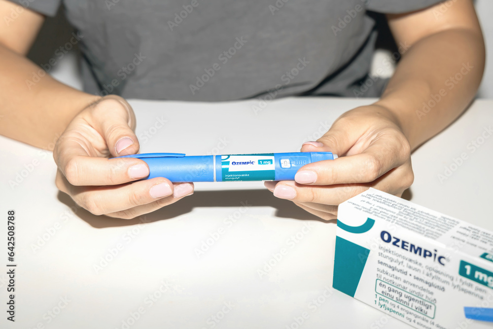 Female hands holding an insulin pen. Ozempic Insulin injection pen ...