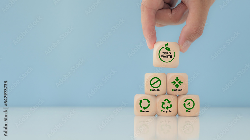 Hand arranging wood block with Zero waste icons and Reuse, Reduce ...