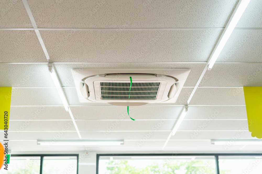 Modern ceiling mounted cassette type air conditioning system in coffee ...
