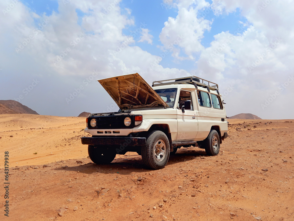 Broken down jeep with the hood open in the desert of the Sinai ...