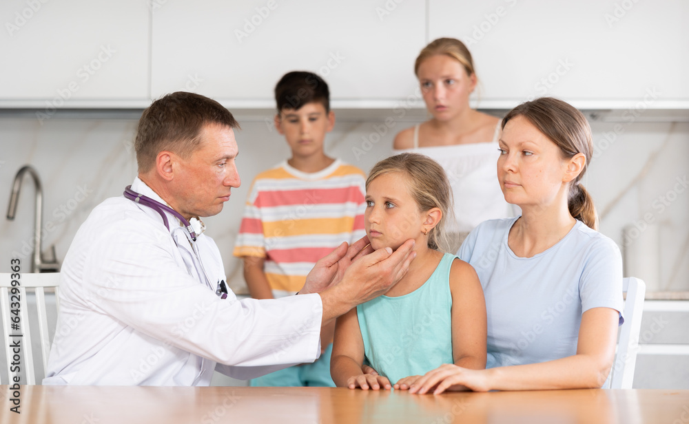 During on-site consultation at home, man doctor feels neck, examines ...