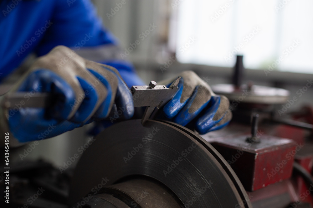 Engineering worker man wearing uniform safety working using vernier ...