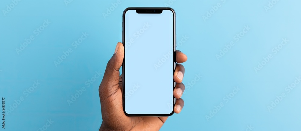 An African American man s hand displaying an empty smartphone screen ...