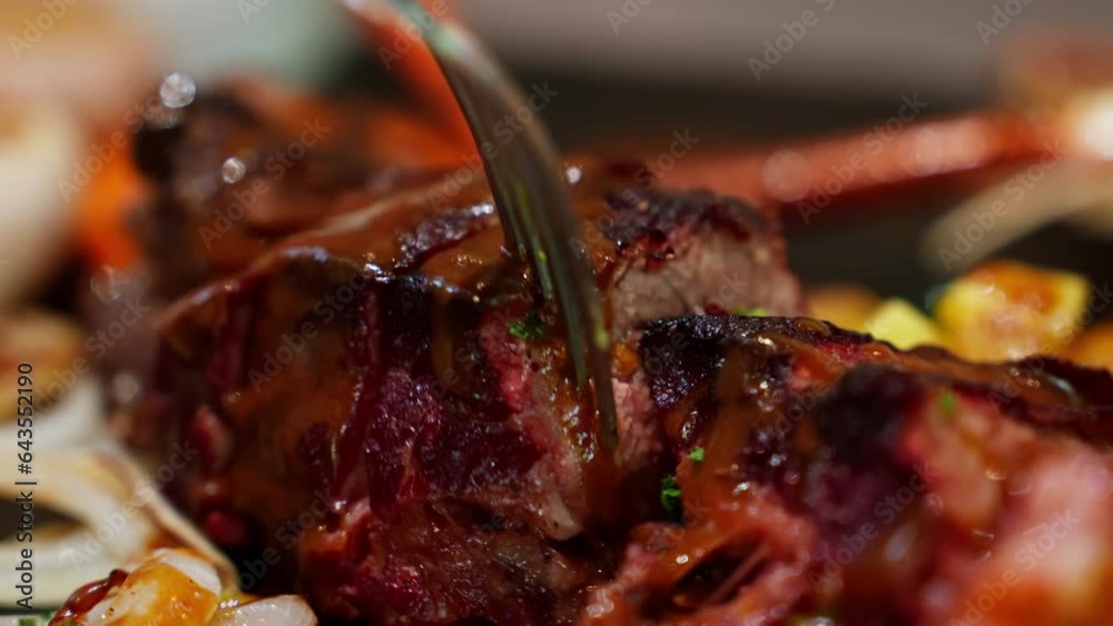 Wideo Stock: tender roast beef is lifted by a fork. The succulent meat ...