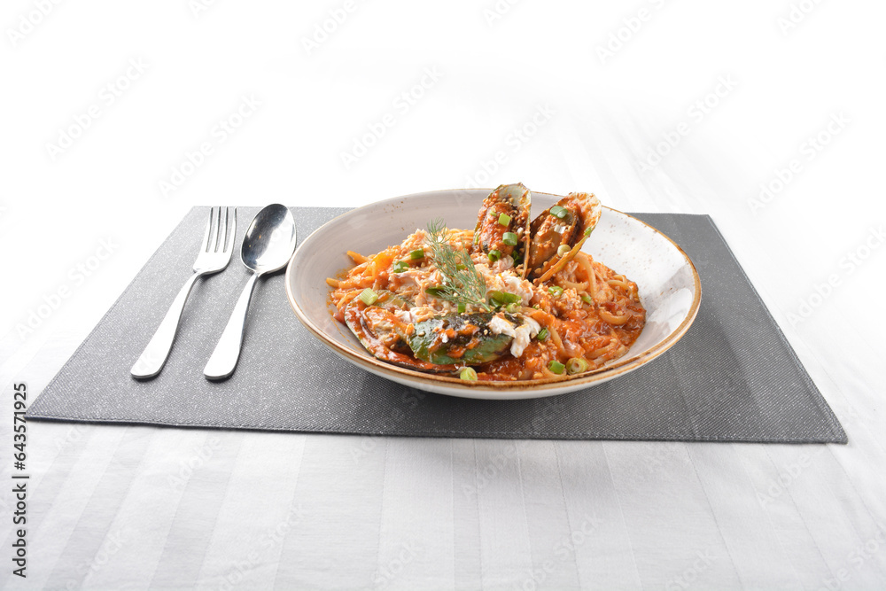 seafood pasta with big tiger prawn, scallop shell clam and muscle in ...