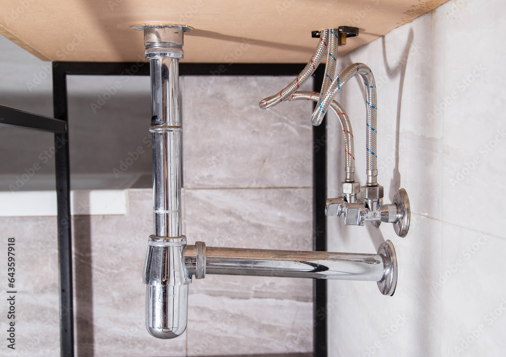 Modern stainless chrome siphon for draining water. Plumbing pipes ...