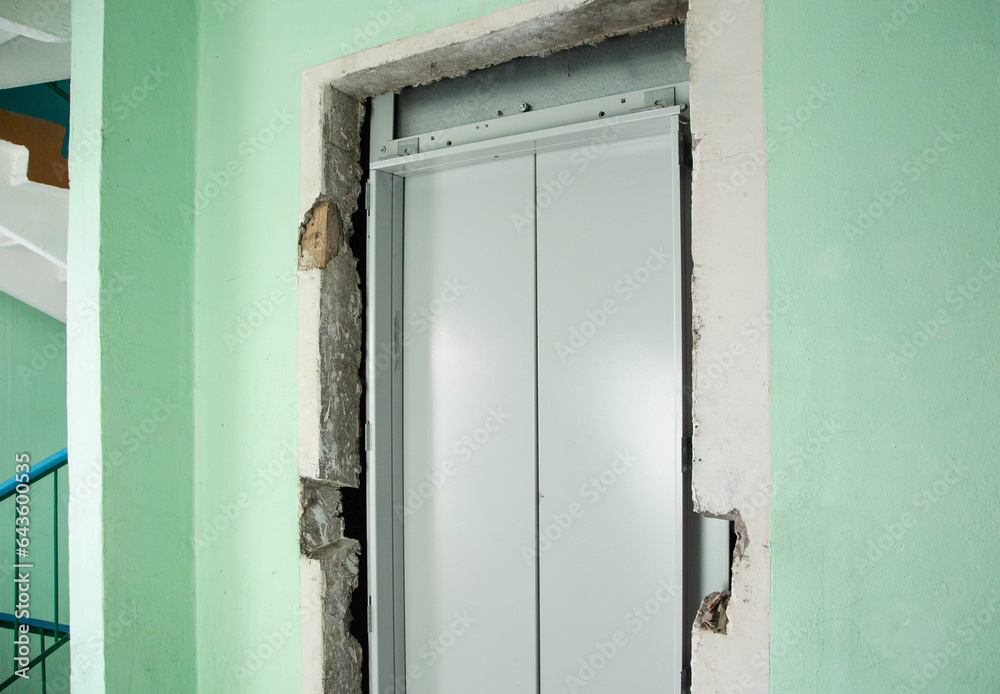 Replacing an old elevator and installing a new one in an apartment ...