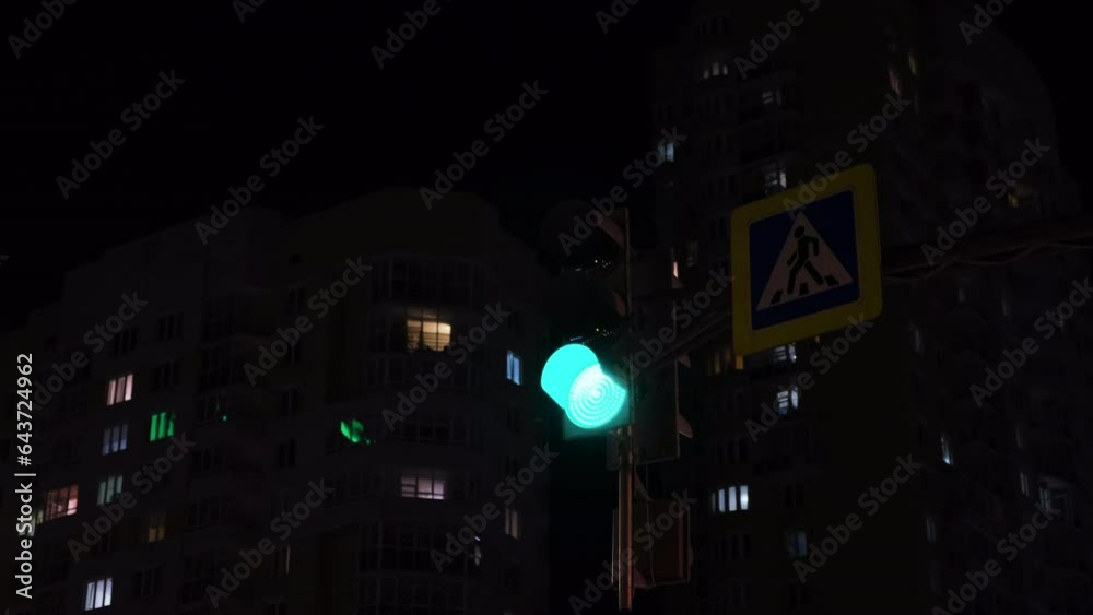 Switching traffic light at night intersection in city. Concept ...