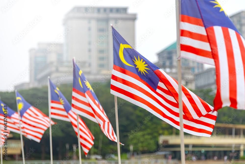 The Malaysia flag is also known as Jalur Gemilang waving with a city in ...