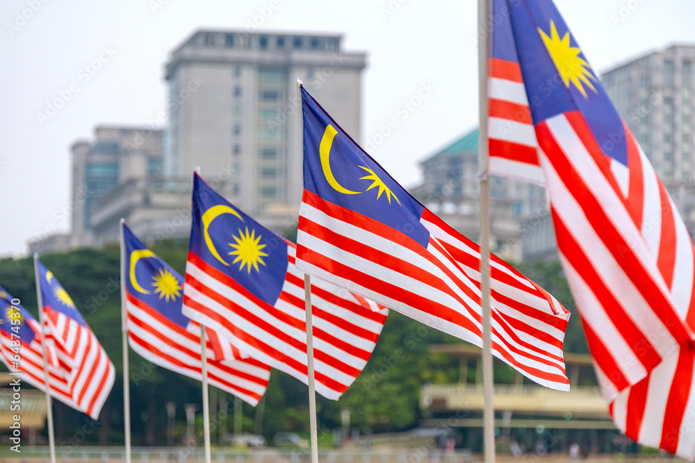 The Malaysia flag is also known as Jalur Gemilang waving with a city in ...