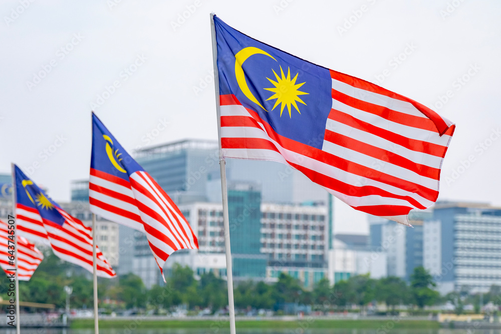 The Malaysia flag is also known as Jalur Gemilang waving with a city in ...