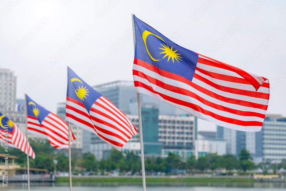 The Malaysia flag is also known as Jalur Gemilang waving with a city in ...
