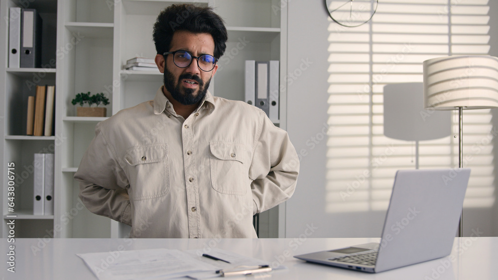 Tired exhausted Indian muslim man businessman unwell male office ...