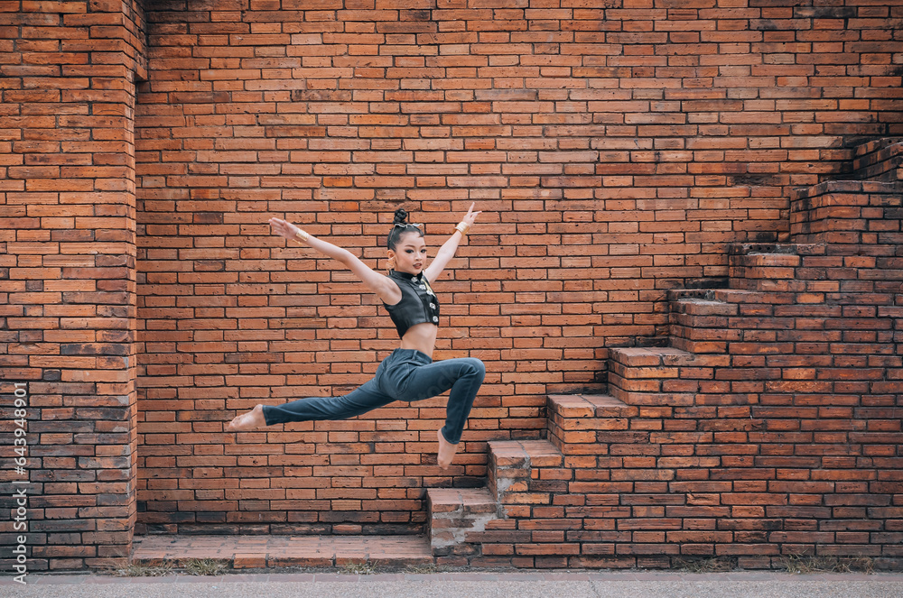 Beautiful young girl doing a ballet jump. Happy dancer isolated on ...