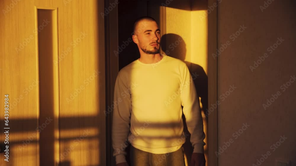 The Man Leaves the Room and the Sun Rays Shine in His Face. Film frame ...