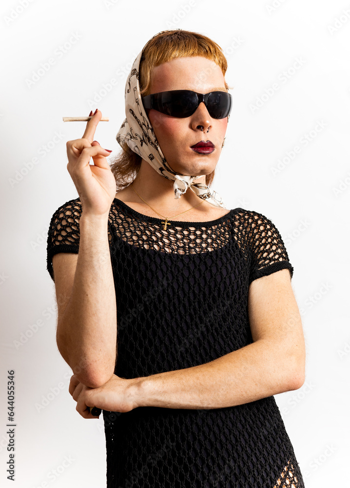 Vertical photo of a red-haired non-binary person is posing on a white ...