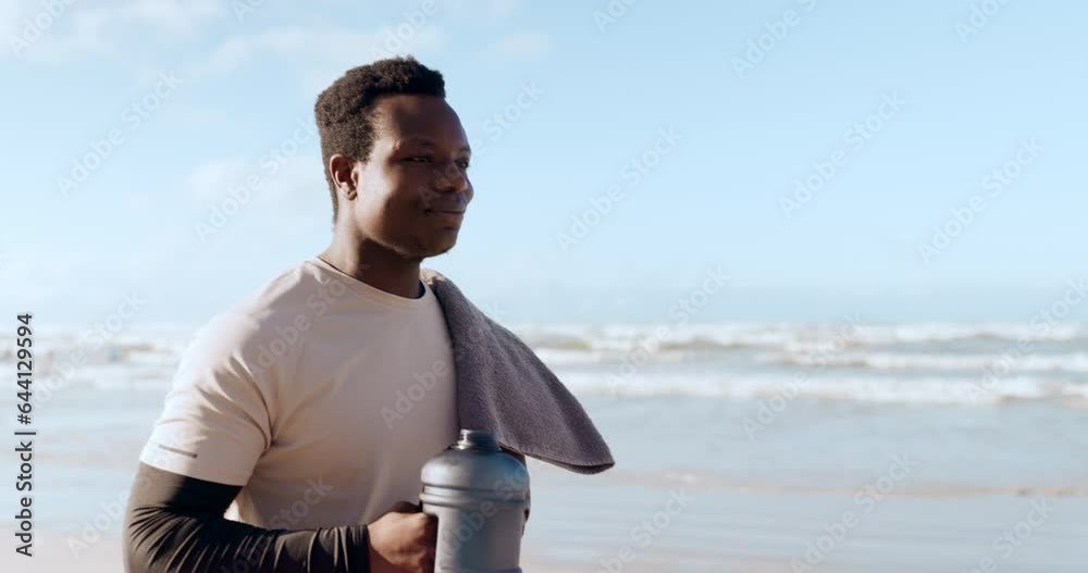 Black man, walking and drinking water in fitness on beach workout ...