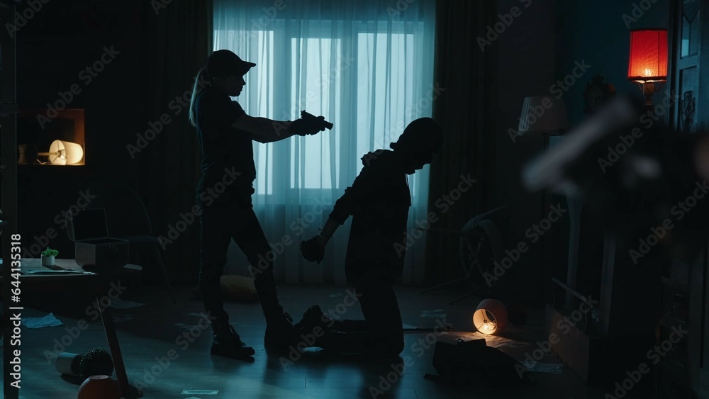 The arrest of the robber in a dark apartment. Side view of a criminal ...