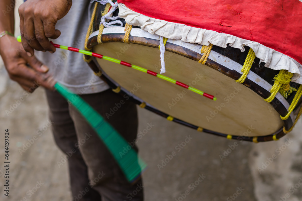 dhak or bengali drum being played during durga puja festival. It is a ...