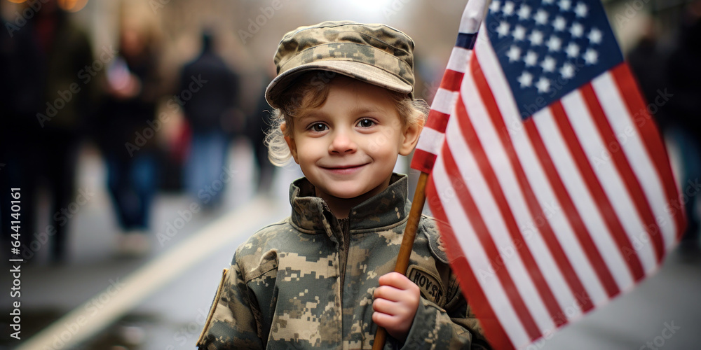 child holding US Flag, stands beside a parade route, in military ...