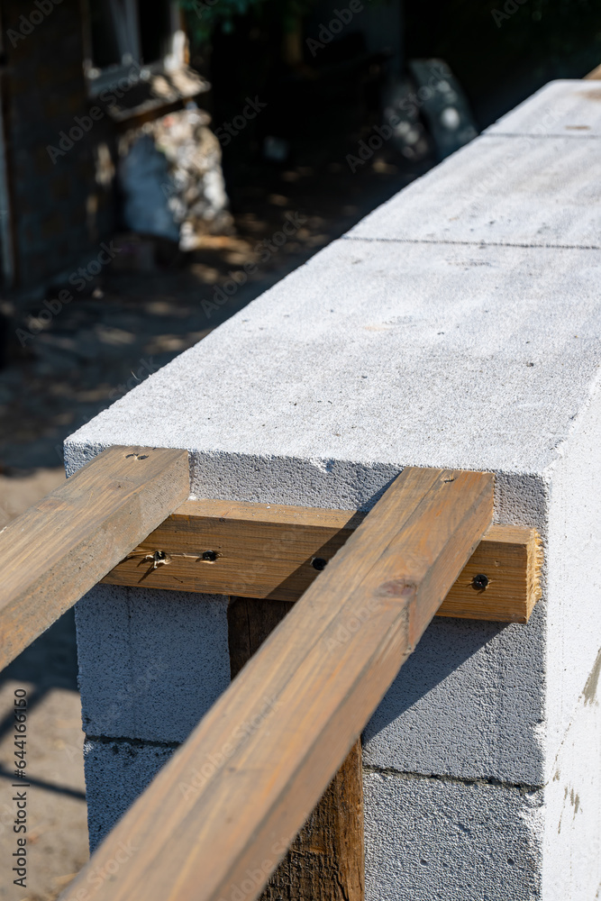 Wall of aerated concrete blocks, window lintels, top view. Laying ...