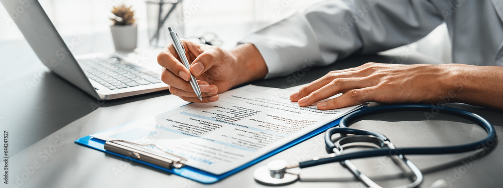 Doctor carefully review detailed medical report with laptop and ...