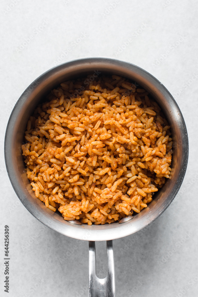 Jollof rice in a silver saucepan, homemade nigerian jollof rice in a ...