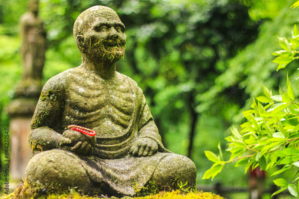 Jizo statuary is a stone guardian statue according to Japanese beliefs ...