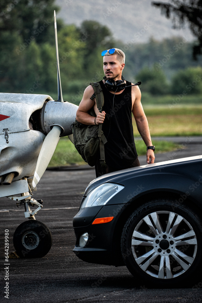 Handsome pilot doing preflight checklist for his private single-engine ...