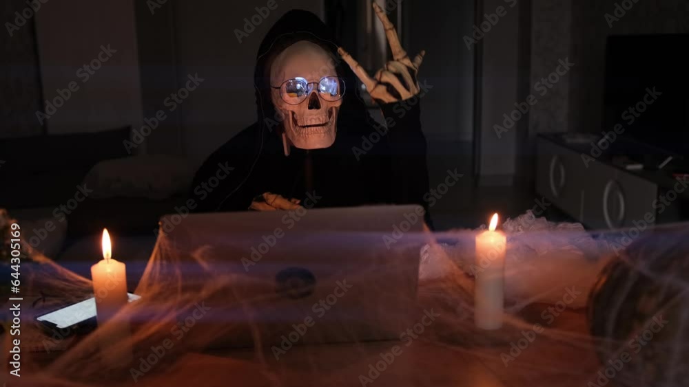 Mysterious man in scary skeleton costume show rocker symbol hand ...