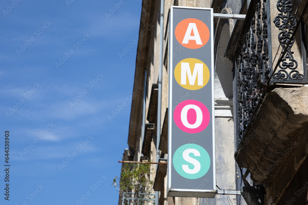 AMOS sign logo text and brand sign on store solidarity fashion movement ...