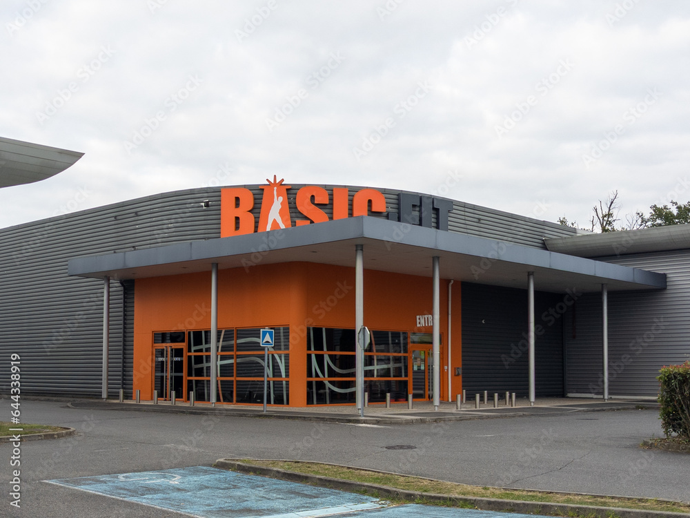 Basic Fit entrance facade logo sporty fitness club sign and text brand ...