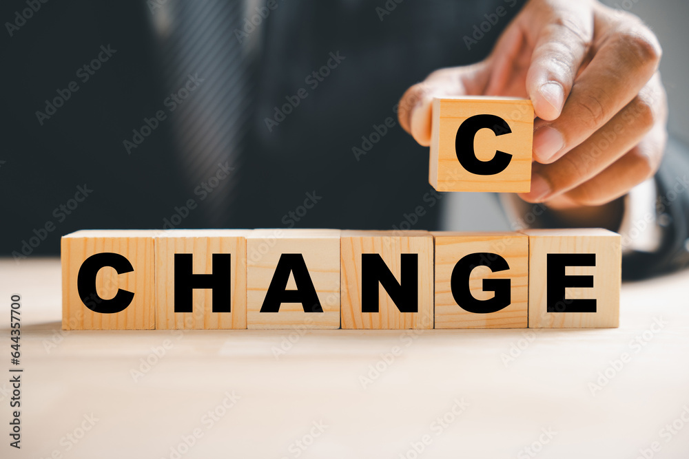 Hand flips wood block, revealing CHANCE from CHANGE. Success, strategy ...