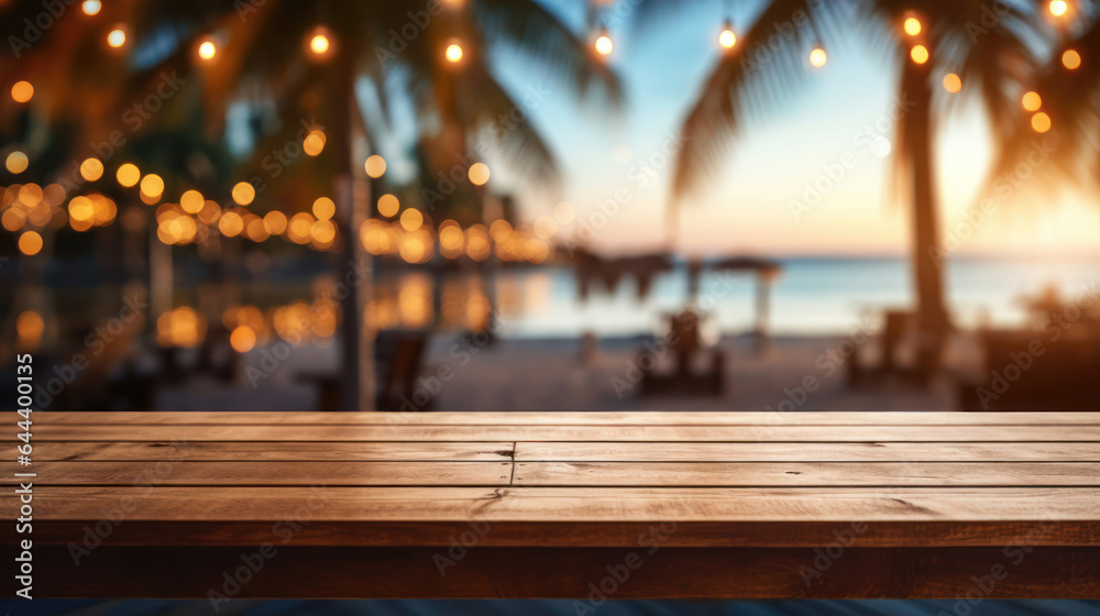 table and blurred background of beach cafe with bokeh lights. Beautiful ...