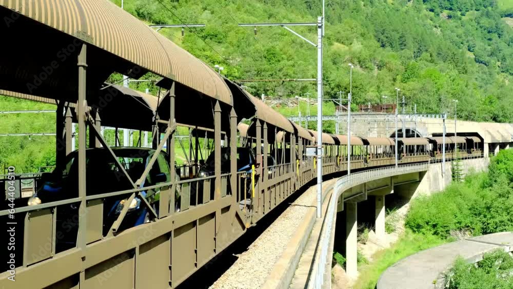 car transport vehicles driving along Lötschberg railway tunnel, old ...