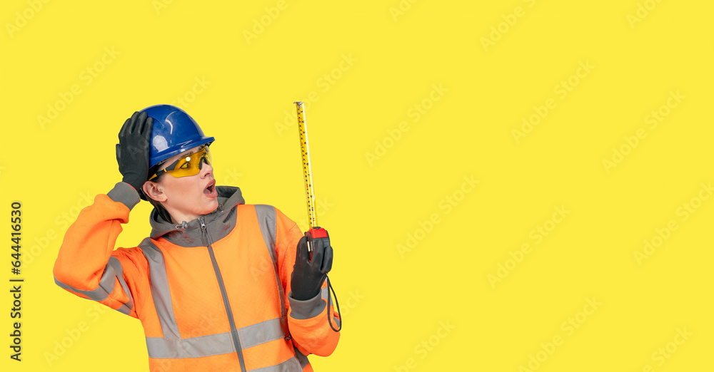 Smiling Woman in hard hat and protective clothes land surveyor working ...