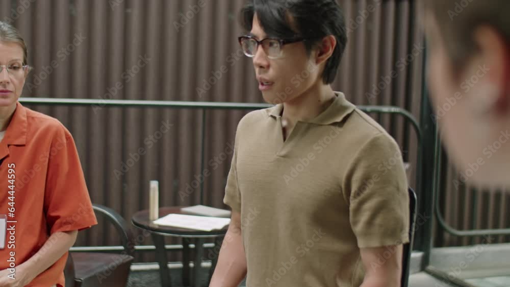 Over the shoulder shot of angry Asian man fighting with wife during ...