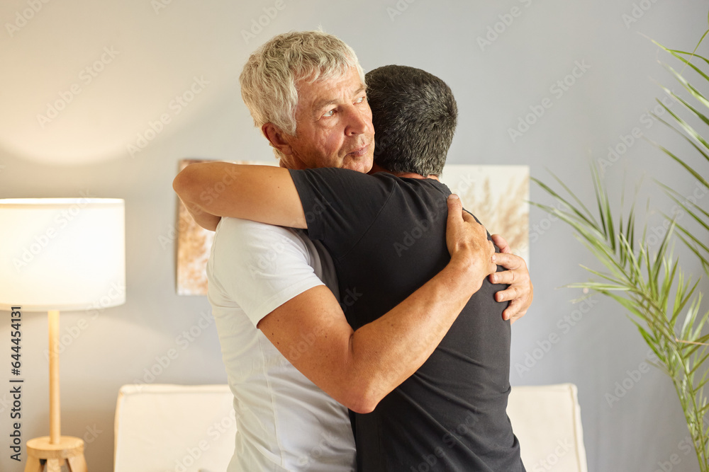 Foto de Cute loving caring old elderly senior father embracing hugging ...